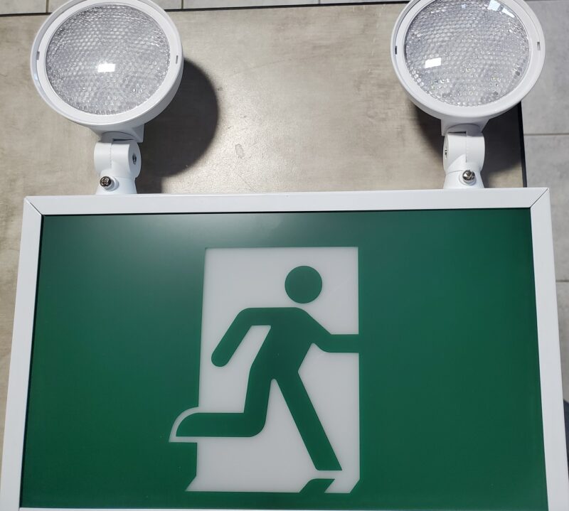 Running Man Exit Sign With Head Lights | APCO Enterprise Inc